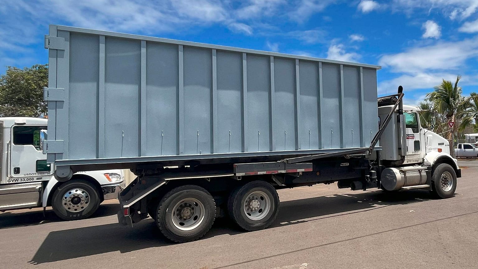 Hooklift Dumpsters vs. Traditional Dump Trucks: Which is Right for Your ...